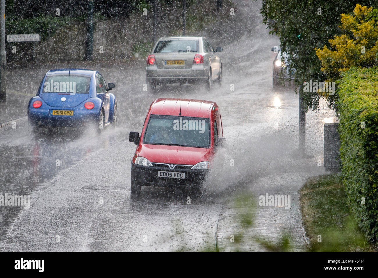 Chippenham, UK, 21st May, 2018. Car drivers are pictured braving heavy ...