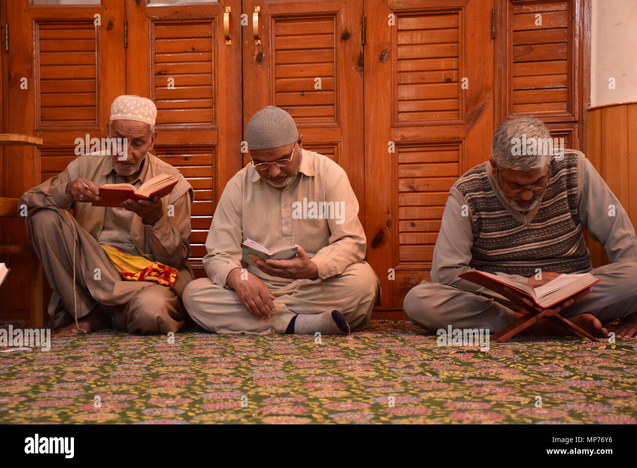 Kashmiri Muslims recite Al-Quran during the Khatam Al-Quran ceremony in ...