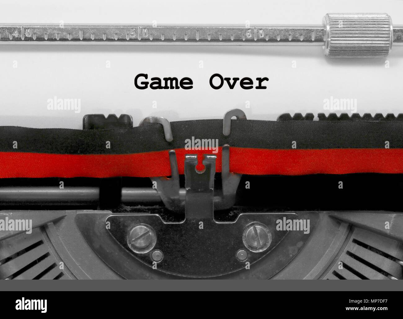 Game Over text written by an old typewriter on white sheet Stock Photo ...