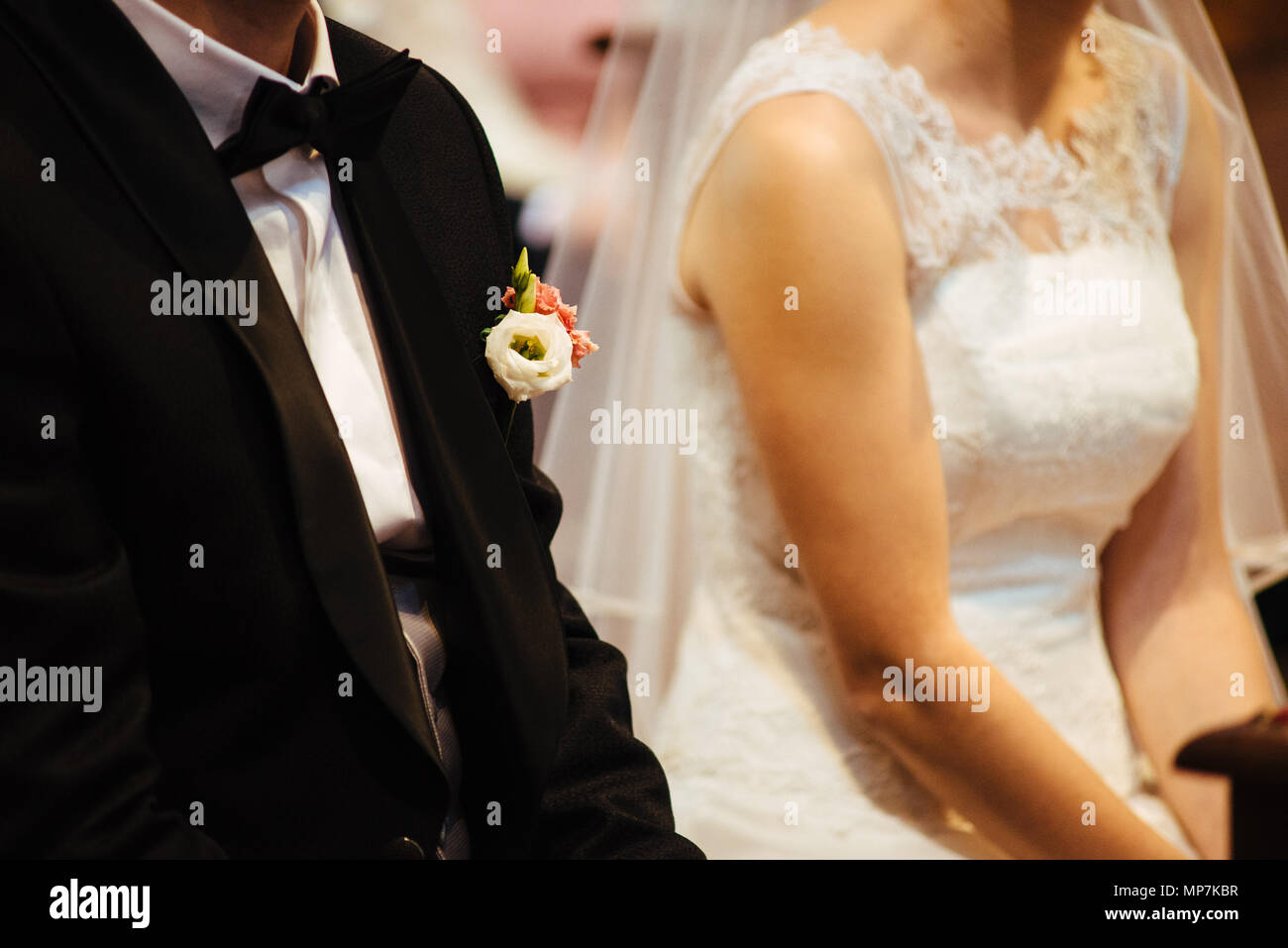 married couple in church during the celebration of the Catholic ...