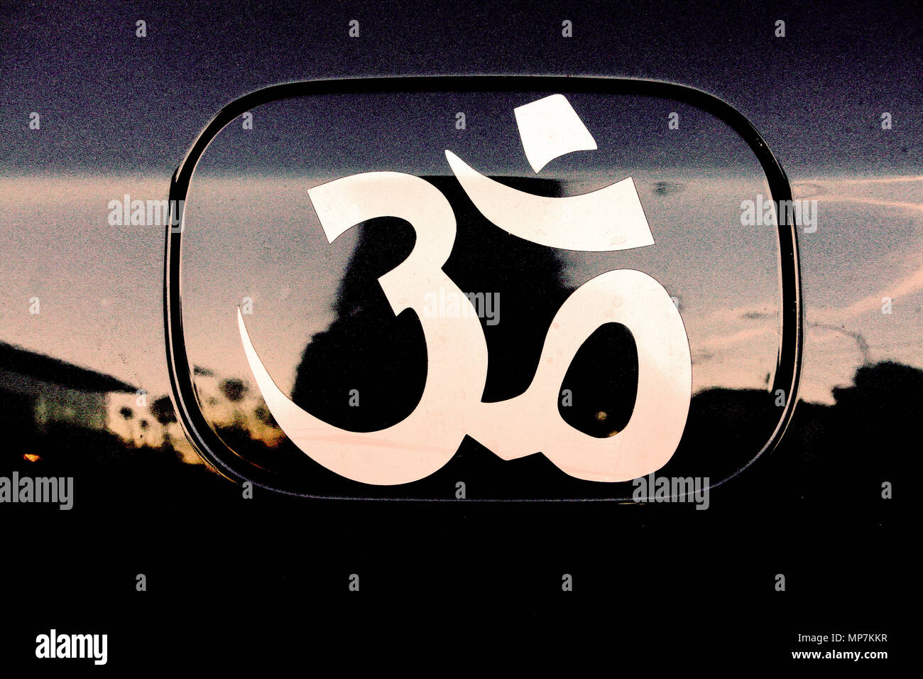 Om symbol design sticker at car caroussel Stock Photo - Alamy