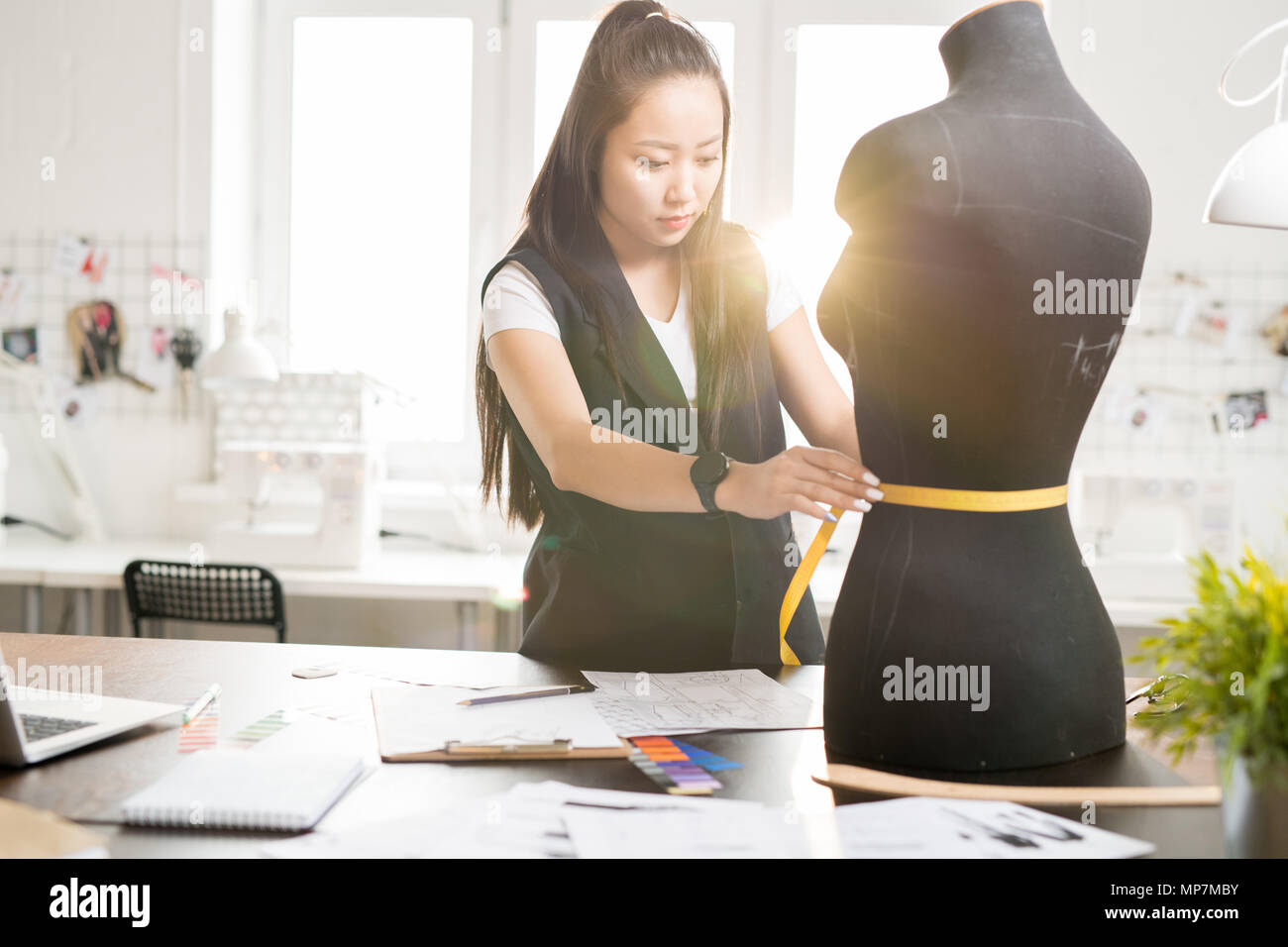 Asian Fashion Designer Working in Atelier Stock Photo - Alamy