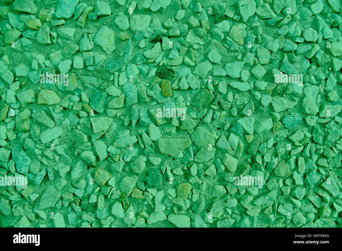 Ultra green Pebble textured surface, stone backdrop and boulder ...