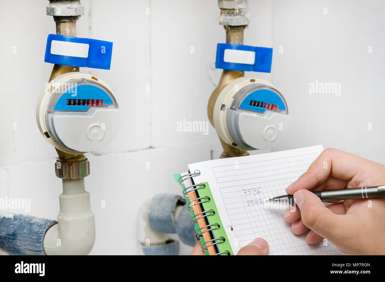 Man notices the water meter. Blue modern radio water counter bill ...