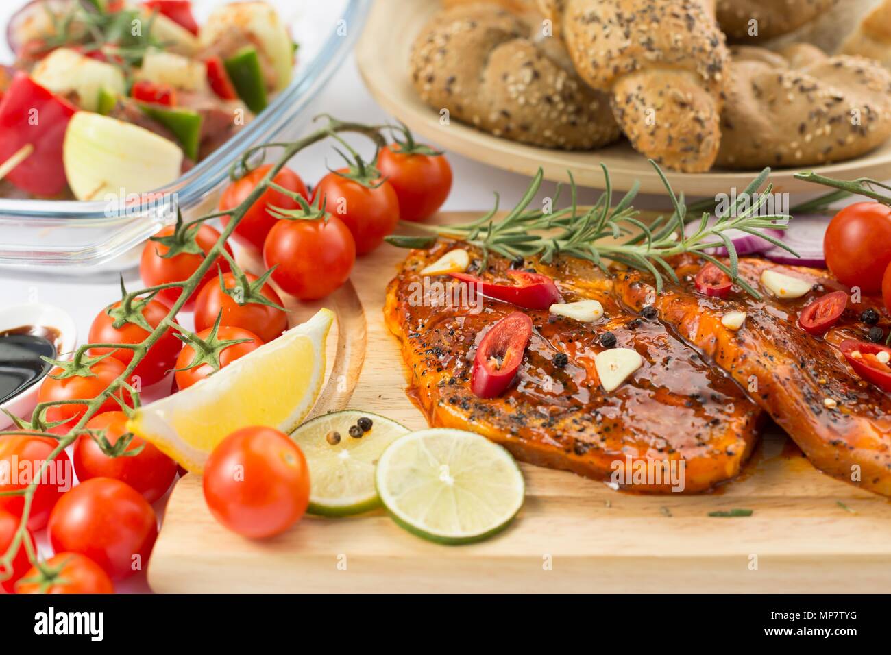 Shot of a table full of meat and vegetables Stock Photo - Alamy