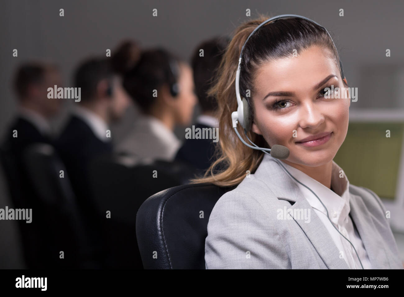 Shot of a young call center agent ready to answer the phone Stock Photo ...