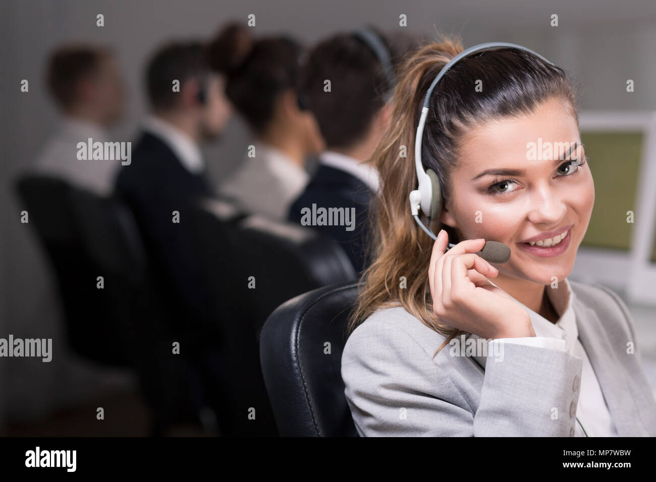 Beautiful woman sitting with microphone and headphones. Isolated on ...