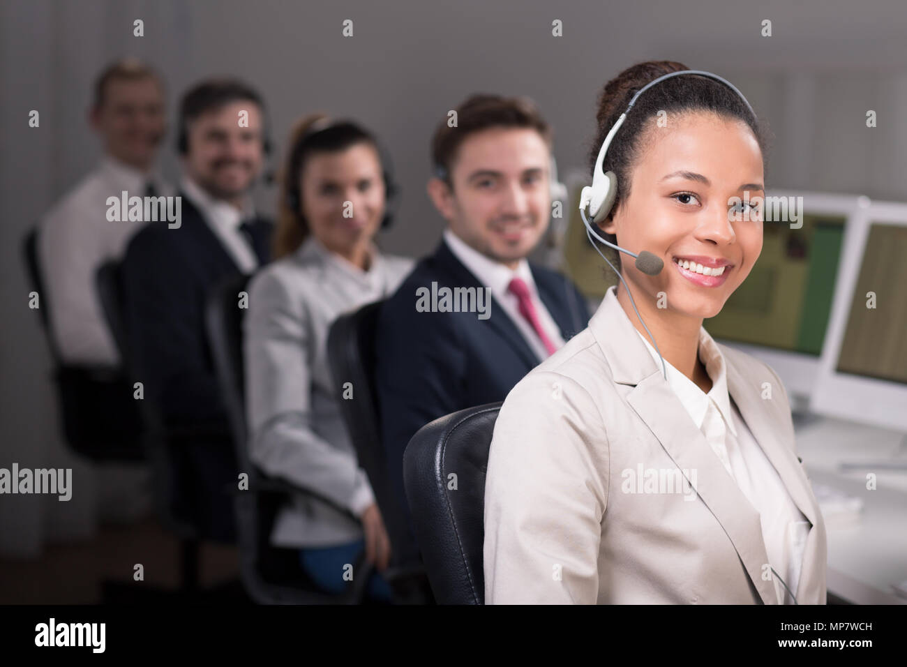 Shot of smiling call center consultants Stock Photo - Alamy