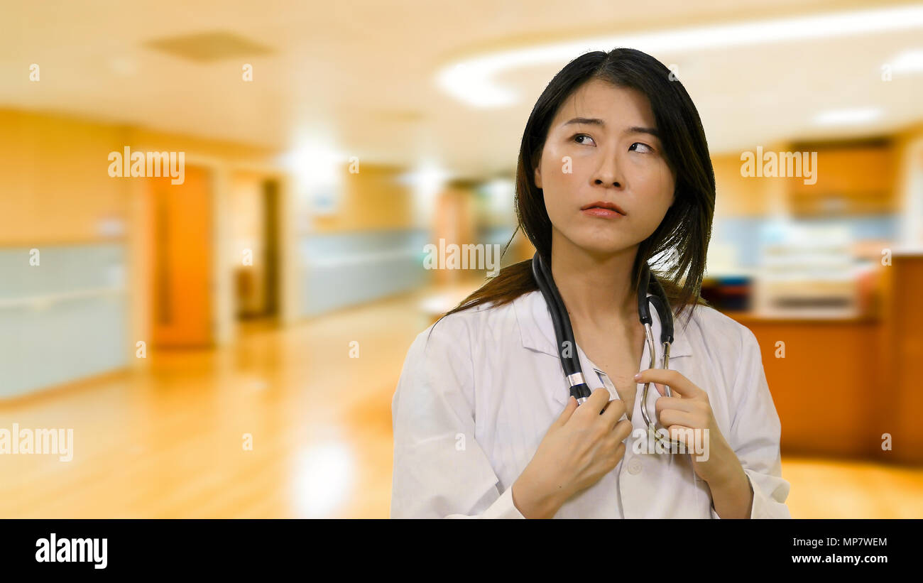 Chinese female doctor in hospital with a worried expression Stock Photo ...