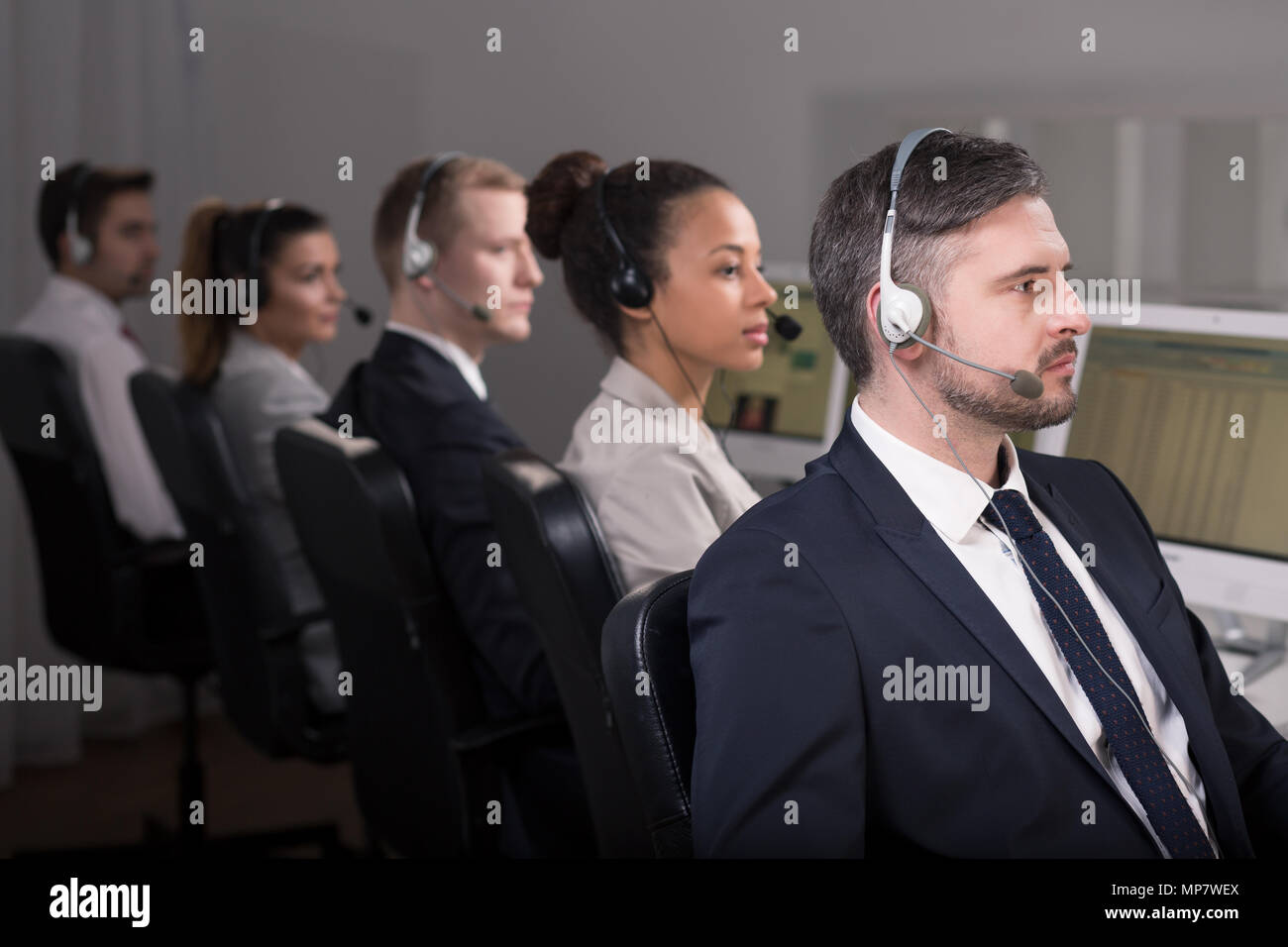 Group of call center workers during work Stock Photo - Alamy