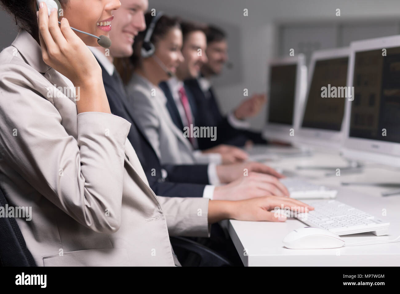 Computer consultants sitting desk hi-res stock photography and images ...