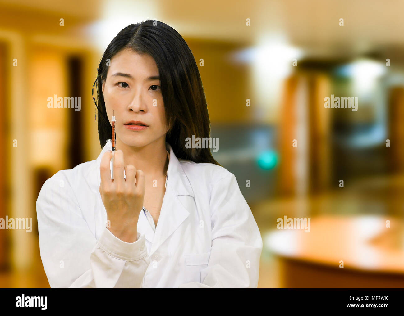Chinese female doctor in hospital holding syringe Stock Photo - Alamy