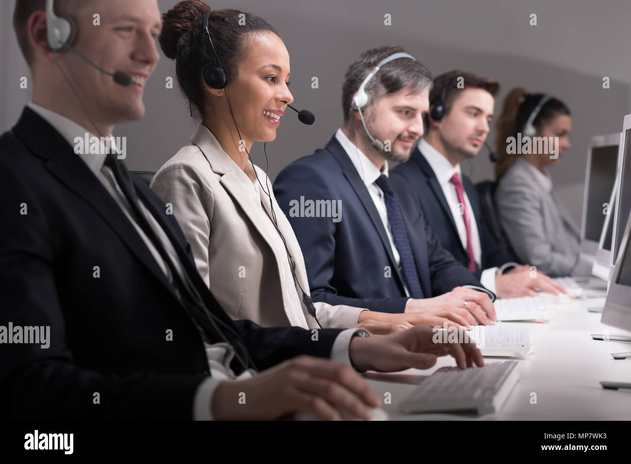 Shot of smiling call center agents Stock Photo - Alamy