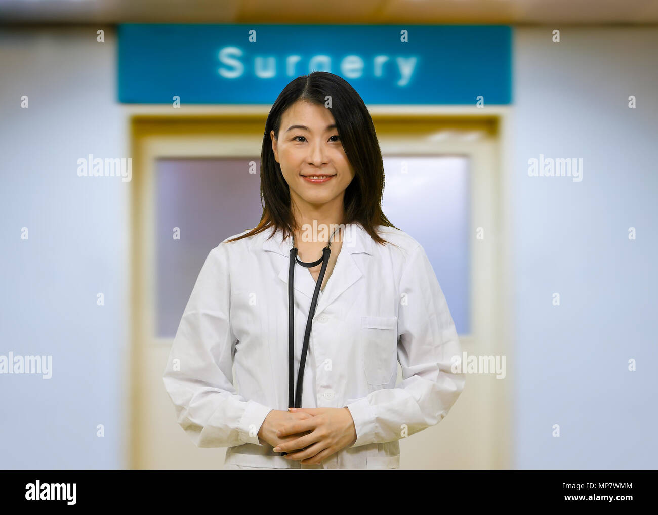 Chinese female doctor in hospital surgery looking at camera Stock Photo ...