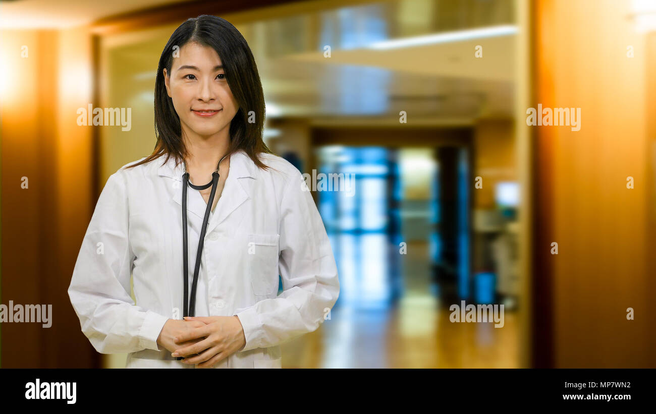 Chinese female doctor in hospital looking at camera Stock Photo - Alamy