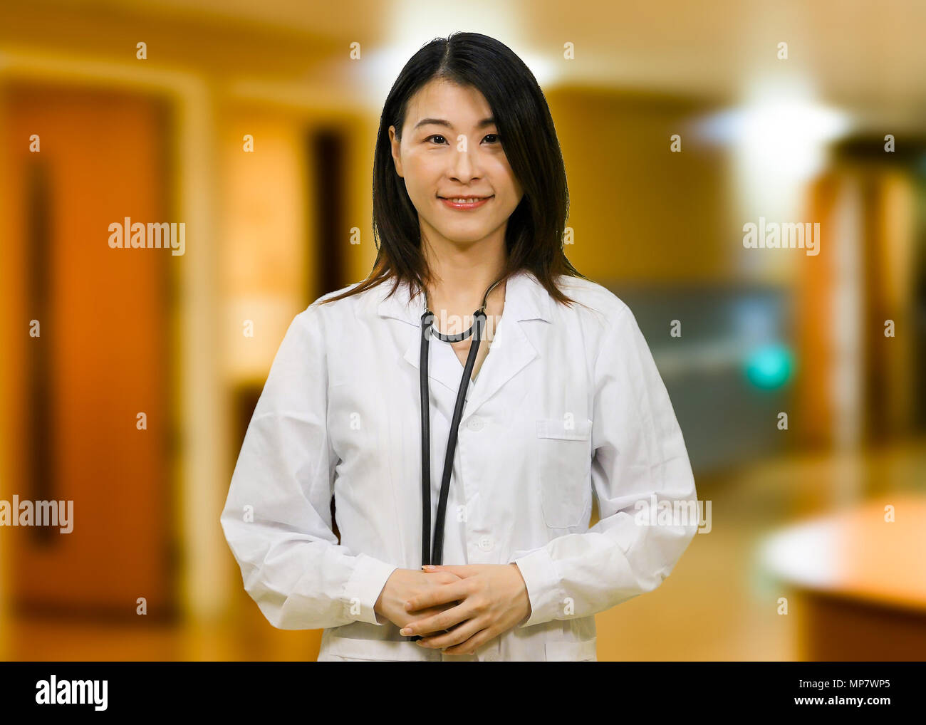 Chinese female doctor in hospital looking at camera Stock Photo - Alamy