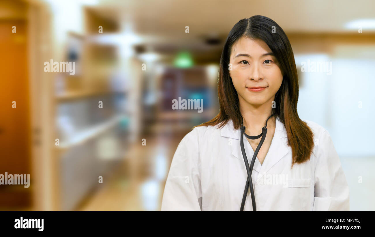 Chinese female doctor in hospital wards looking at camera Stock Photo ...