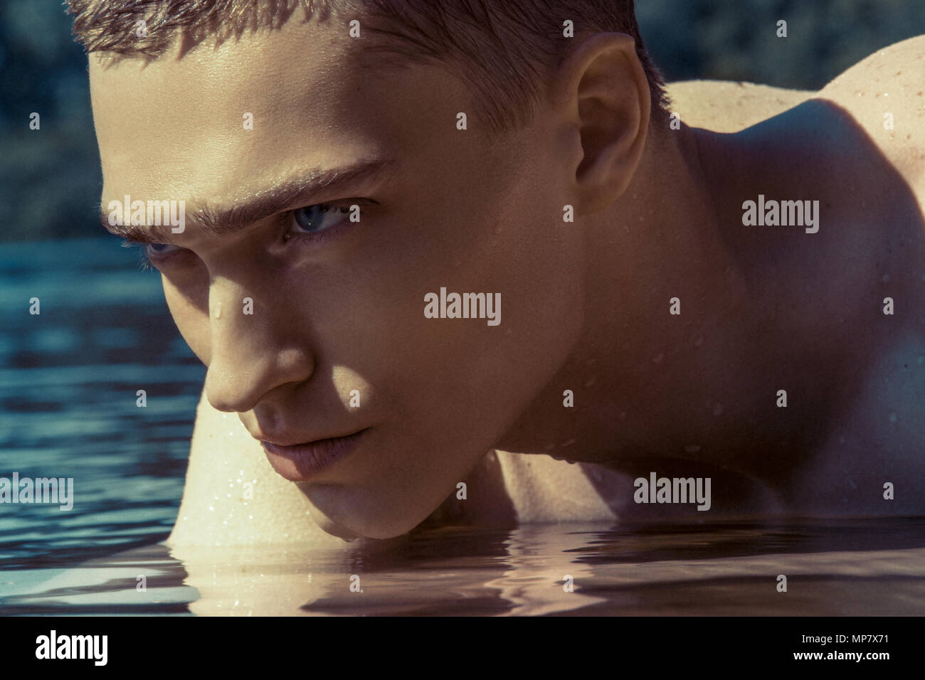 Male portrait in clear blue sea water Stock Photo - Alamy