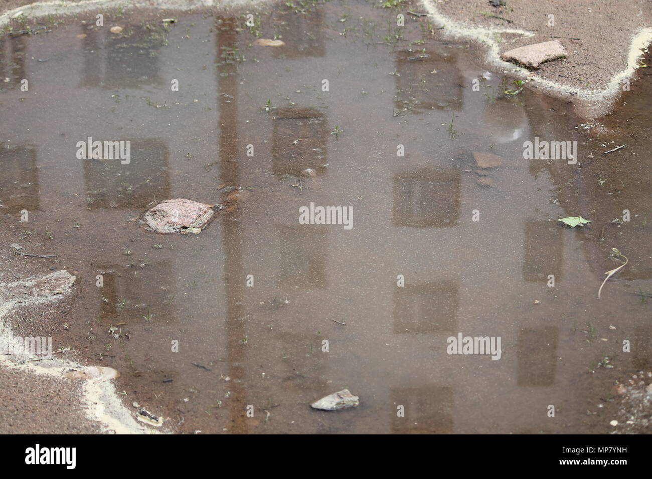 Rain puddle city hi-res stock photography and images - Alamy