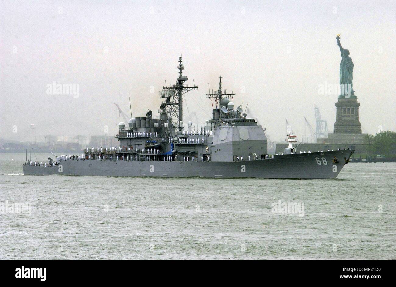 The U.S. Navy Ticonderoga-class guided-missile cruiser USS Anzio steams ...