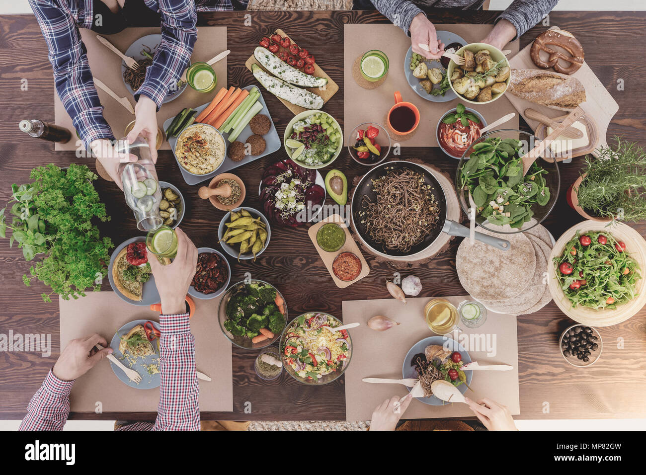 Verious veg dishes lying on rustic table, top view Stock Photo - Alamy