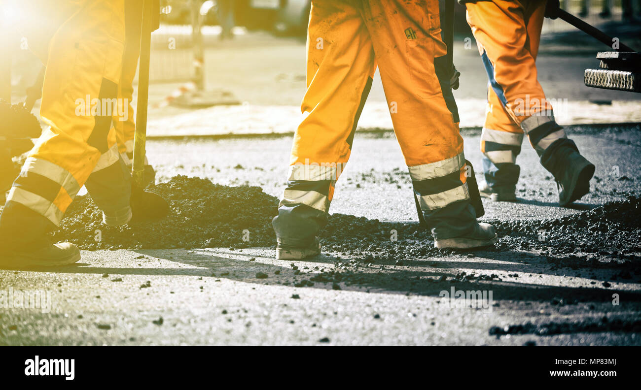 Teamwork, Group of workers on a road construction, team of people at ...