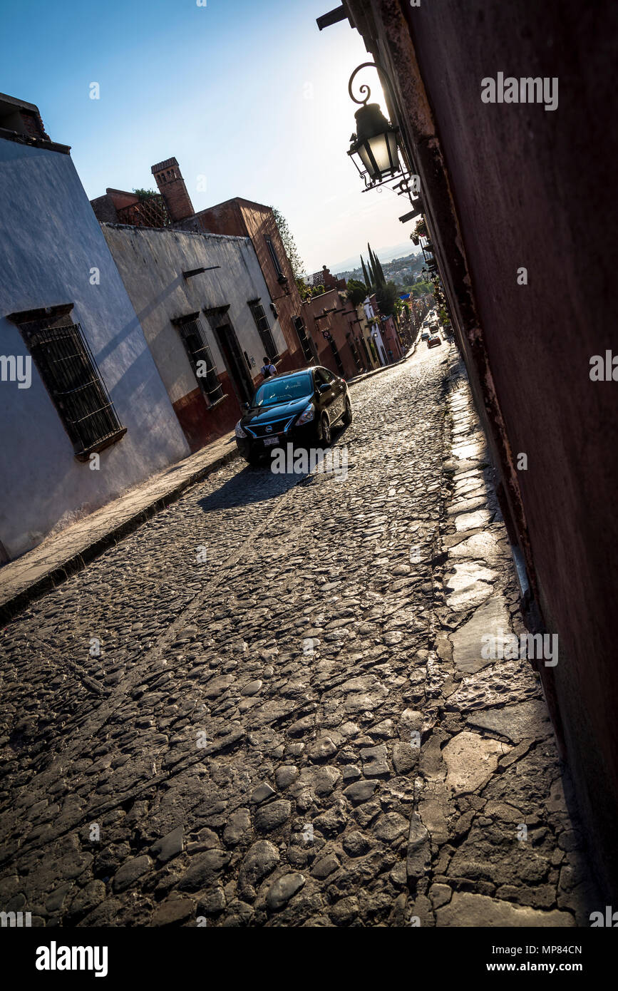 Cobblestoned street in historic centre in late sunshine, San Miguel de ...