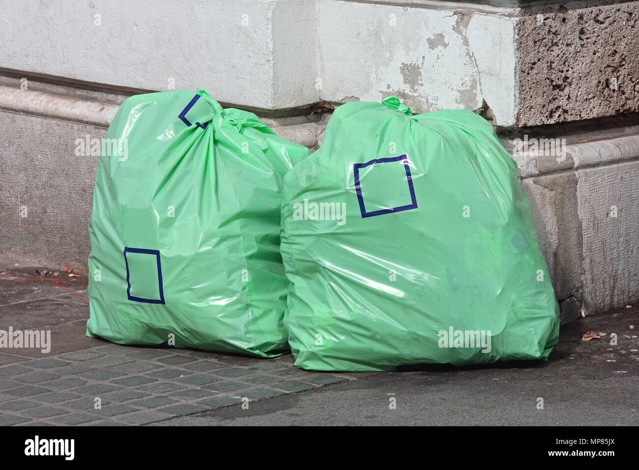 Two Garbage Bags at Street Corner Stock Photo - Alamy