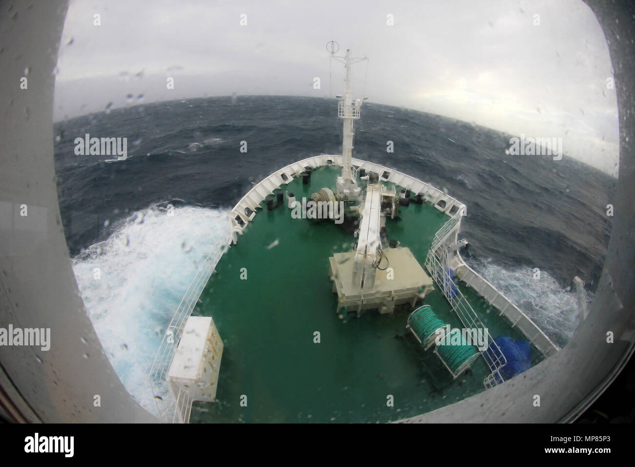 Shipp bow diving into a big splashing wave, Antarctic Peninsula ...