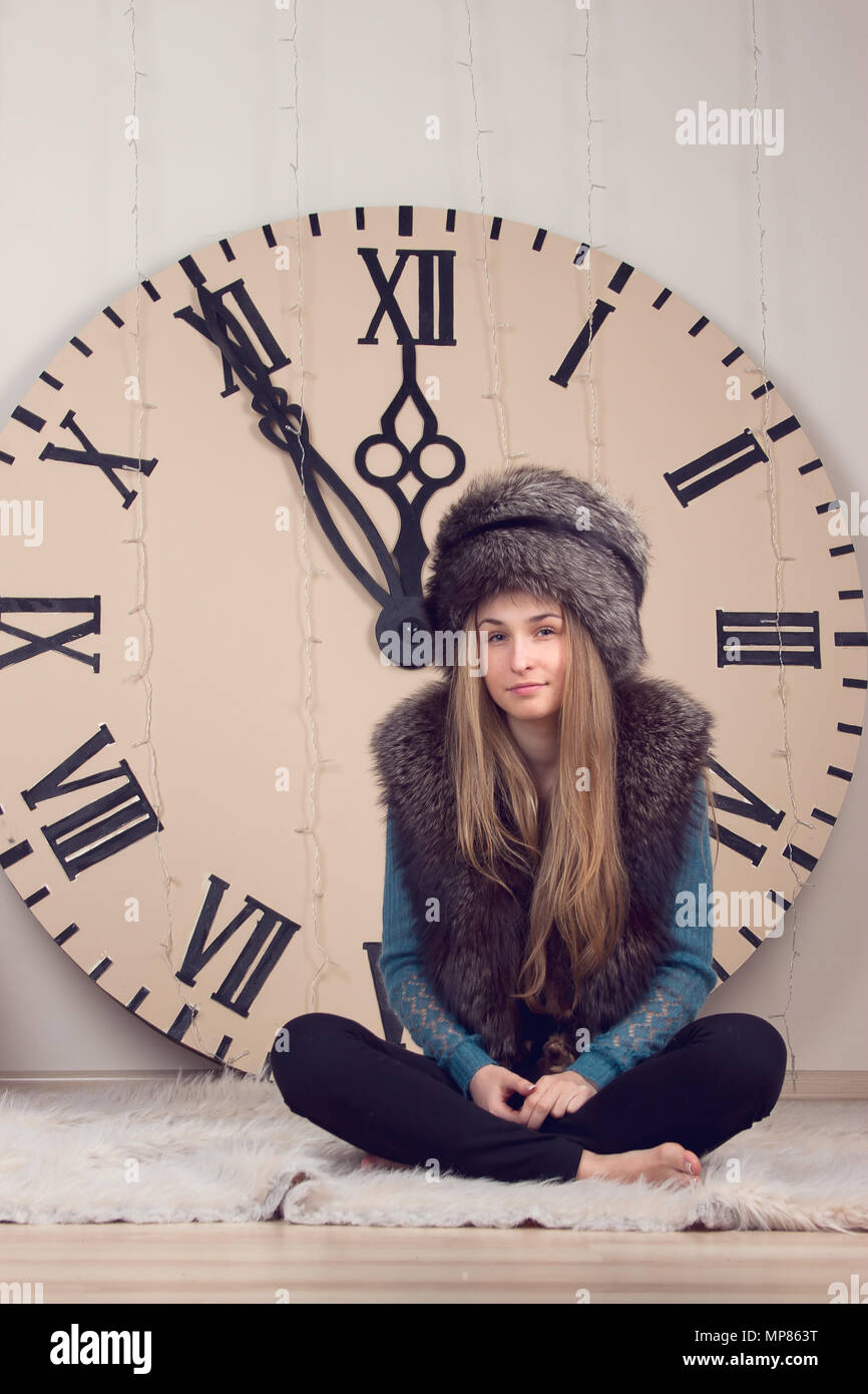 beautiful girl on clocks background lunch time Stock Photo - Alamy