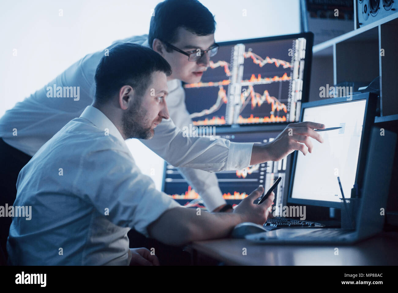 Analyzing data. Close-up of young business team working together in ...