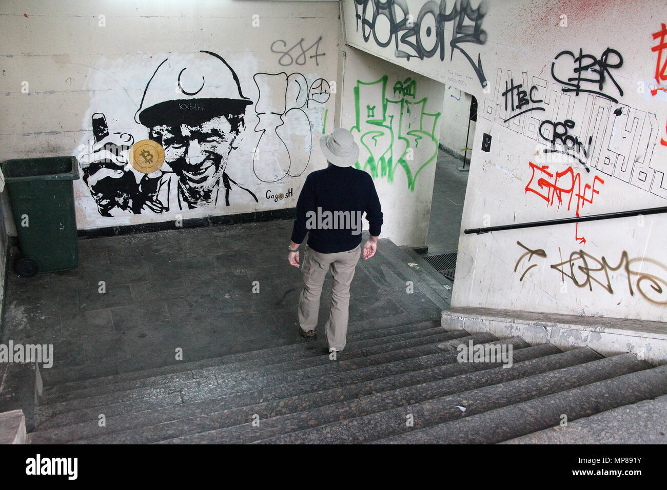 Man walking through an underpass in Tbilisi Stock Photo - Alamy