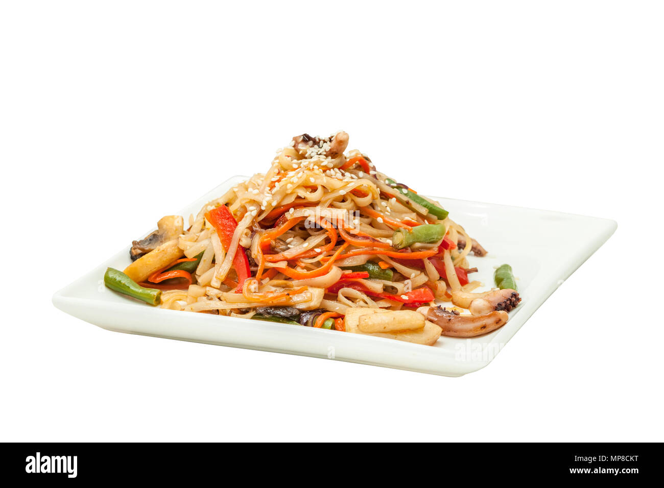 Chinese noodles with beef and vegetables on a square plate isolated ...