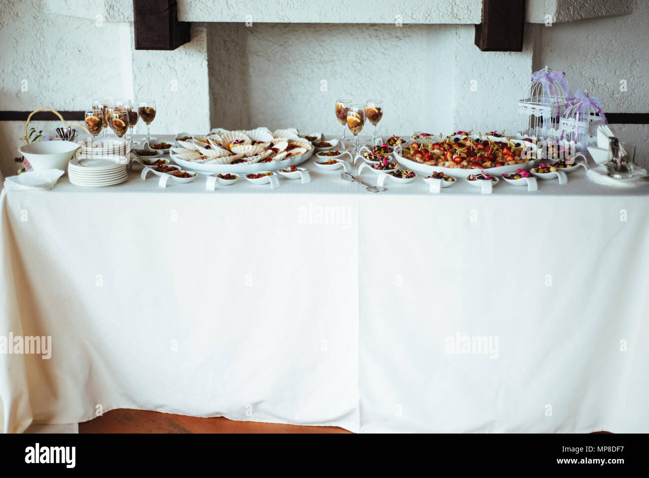table set with plates of canapés for reception and wedding party Stock ...