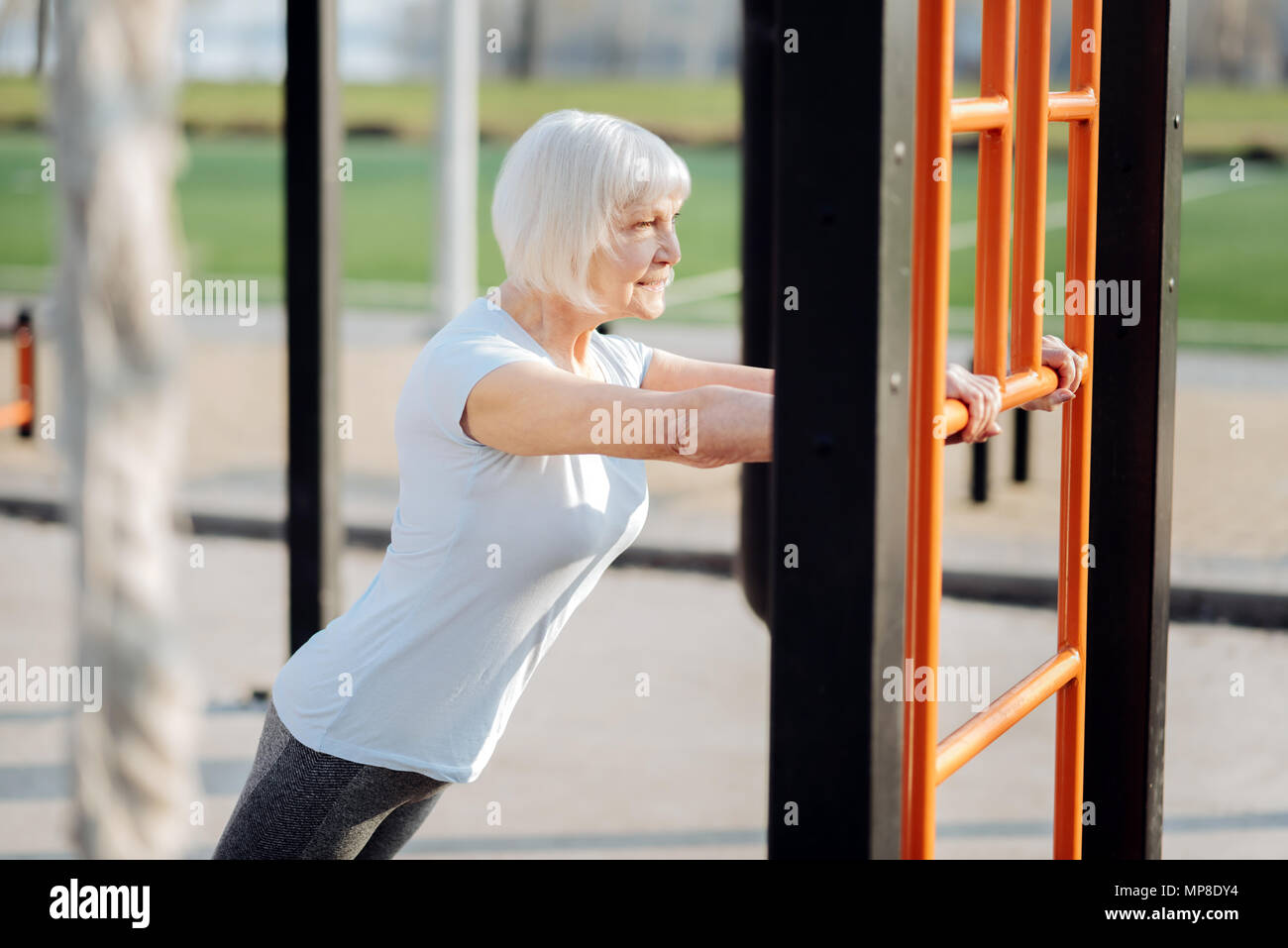 Serious woman training on the sports ground Stock Photo - Alamy