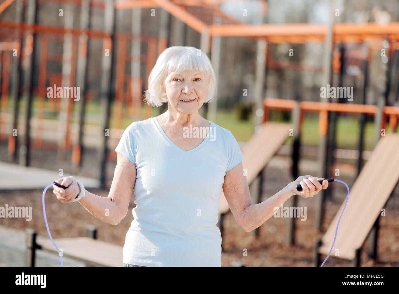 Alert aged woman jumping her rope Stock Photo - Alamy
