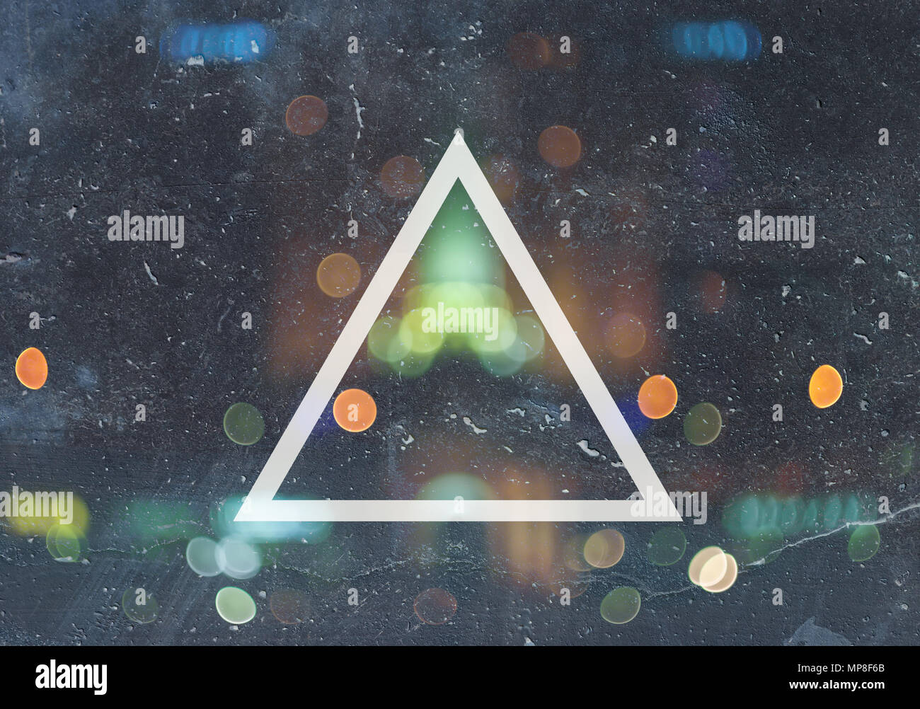 White flat triangle on blurry night city background Stock Photo - Alamy