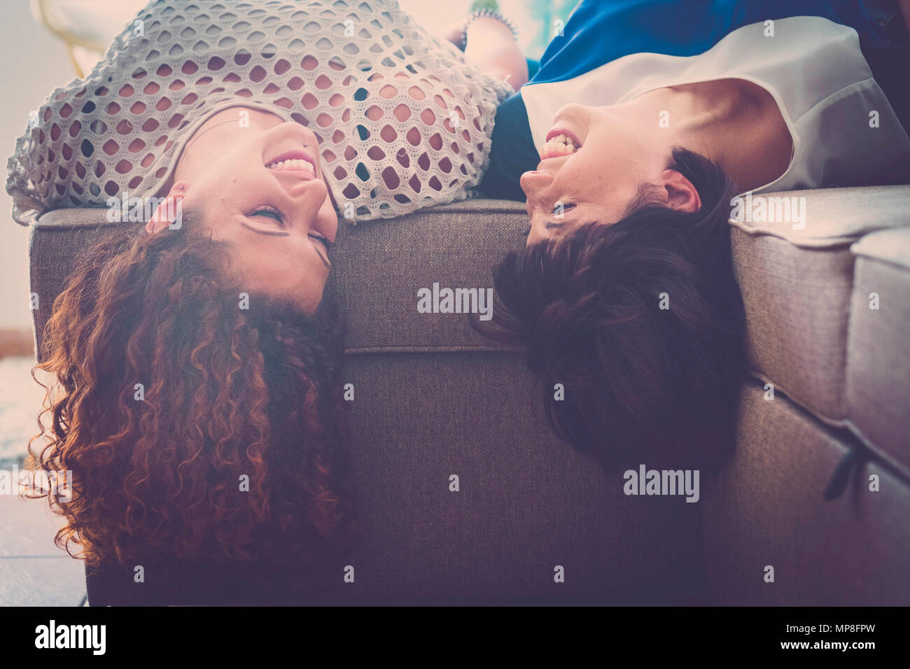 happy time with fun for a couple of young woman laughing and smiling at ...