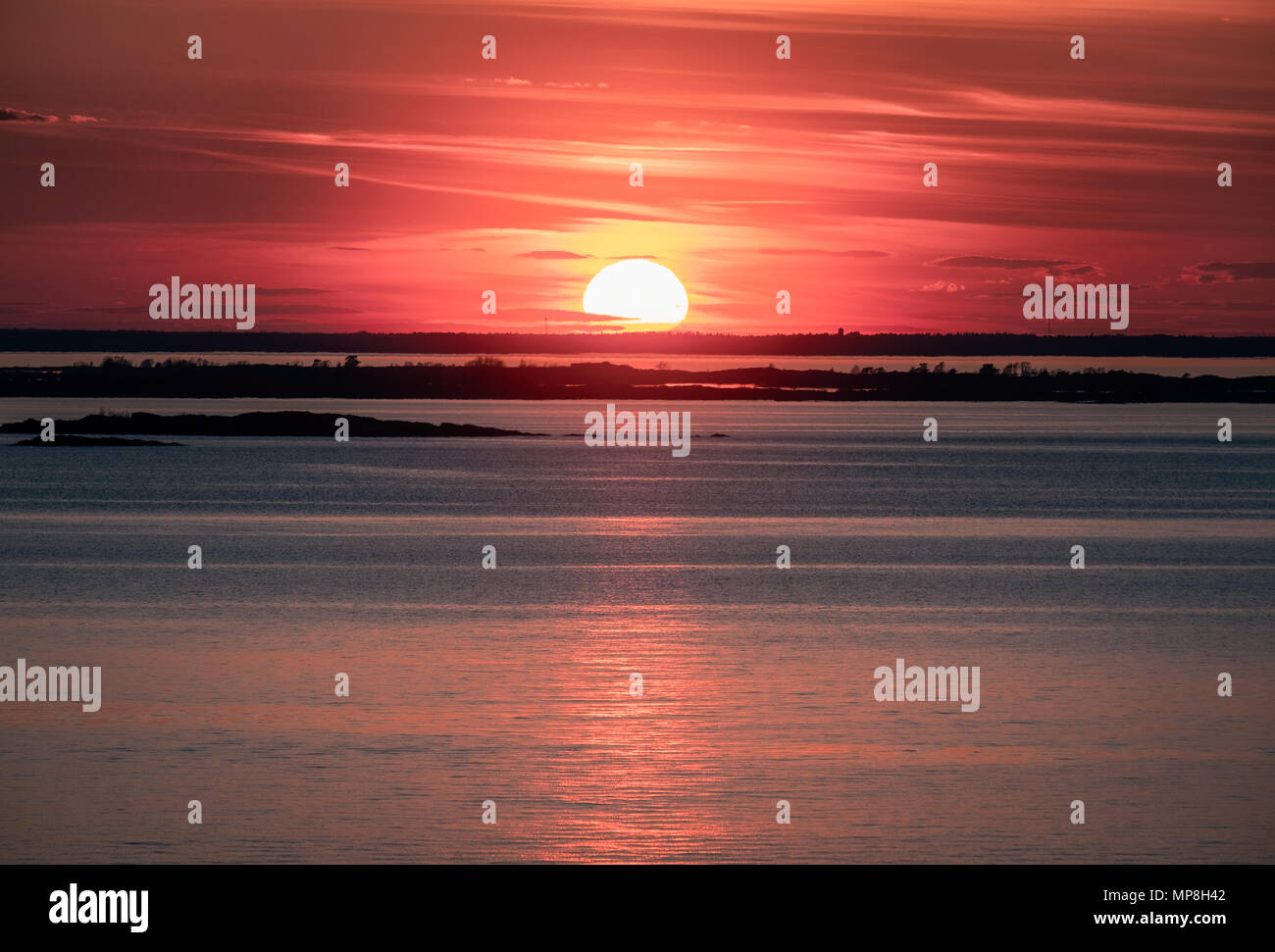 Scenic sunset with empty sea and colorful sky at evening in Finland ...