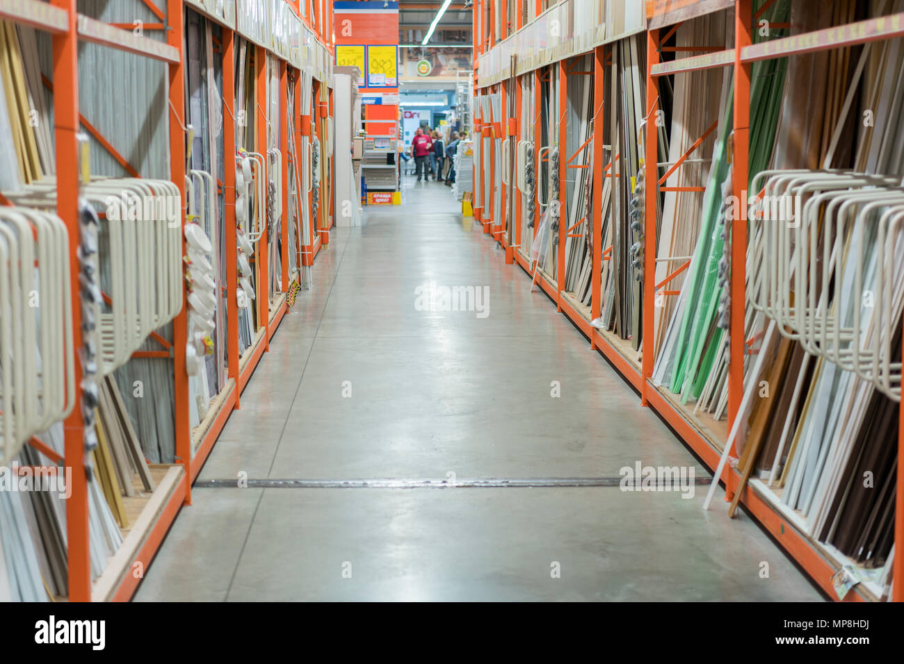 interior of hardware retailer with aisles, shelves, racks of building ...