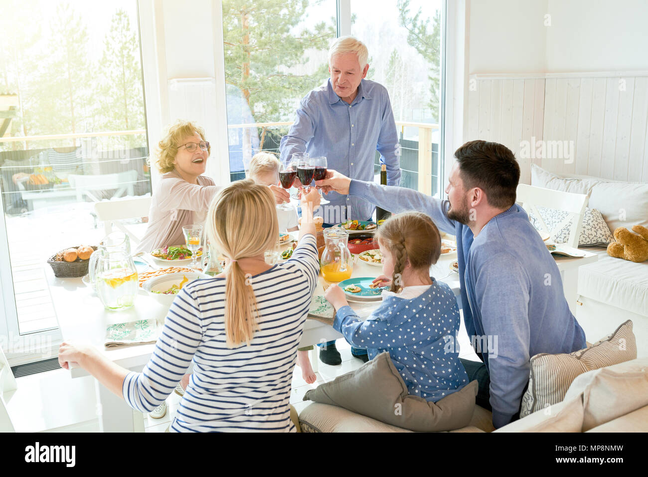 Family Gathering at Dinner Stock Photo - Alamy