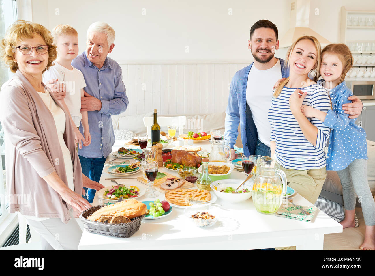 Portrait of a happy extended family standing in the park Stock Photo ...