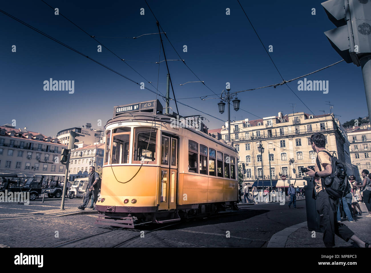 Lisbon, Portugal, May 5, 2018: People walk by a famous tram 28 in ...