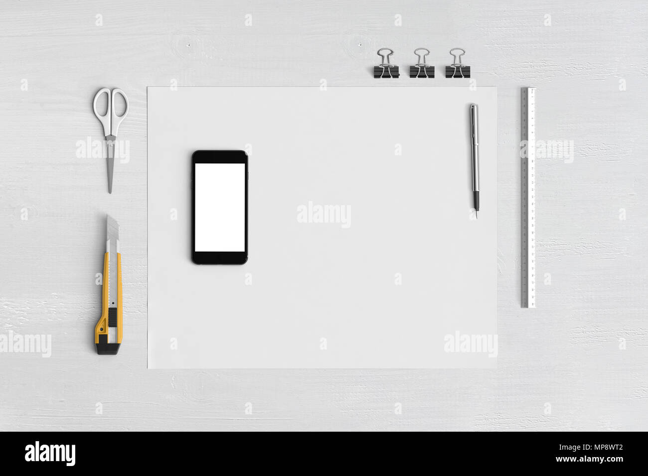 Office set with white sheets of paper, mobile phone and stationery on ...