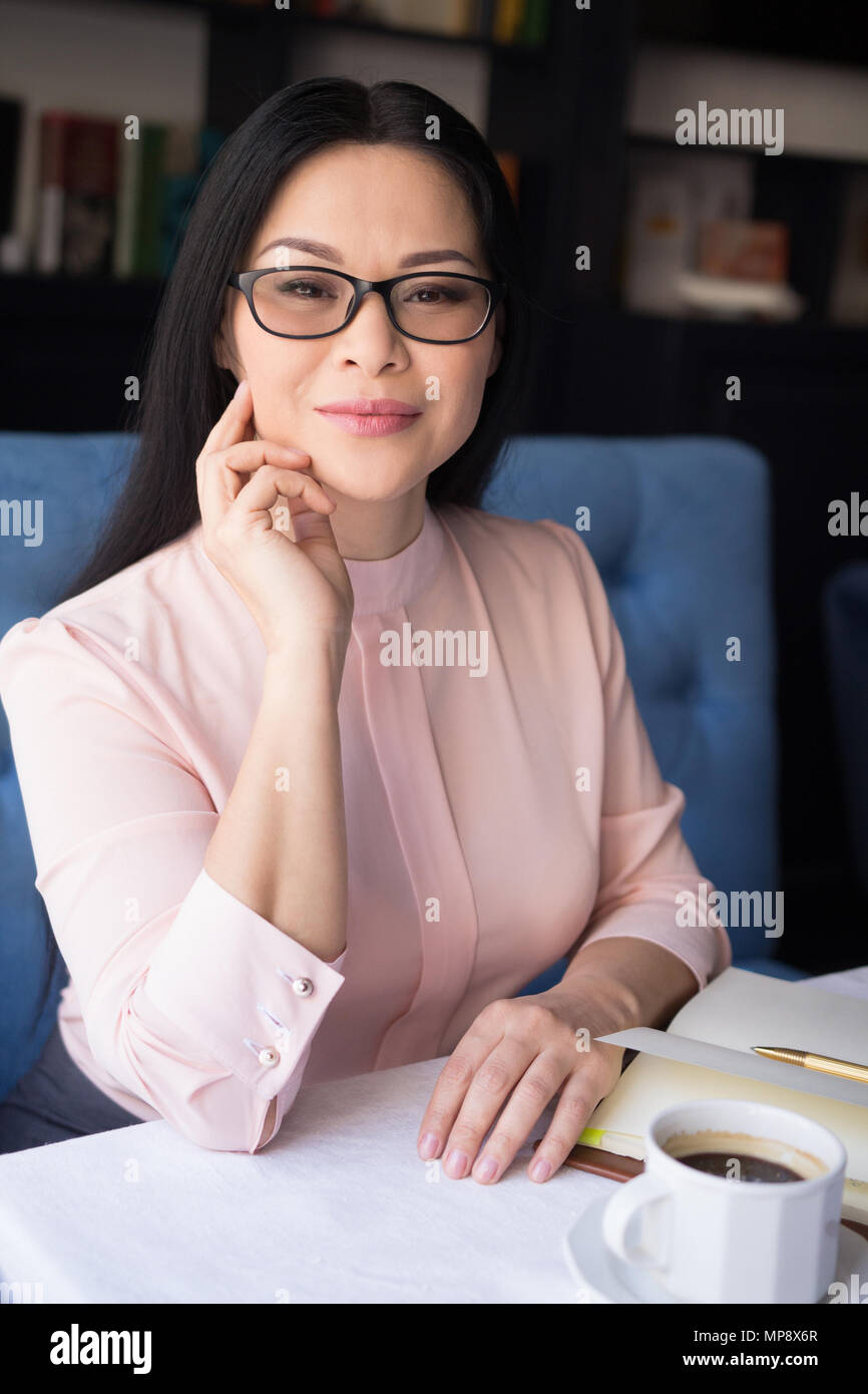 Beautiful young woman making notes Stock Photo - Alamy