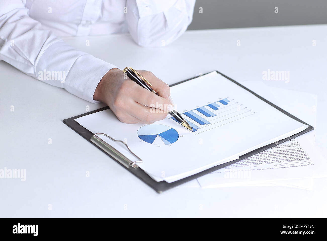 closeup.business woman checking marketing graphics Stock Photo - Alamy