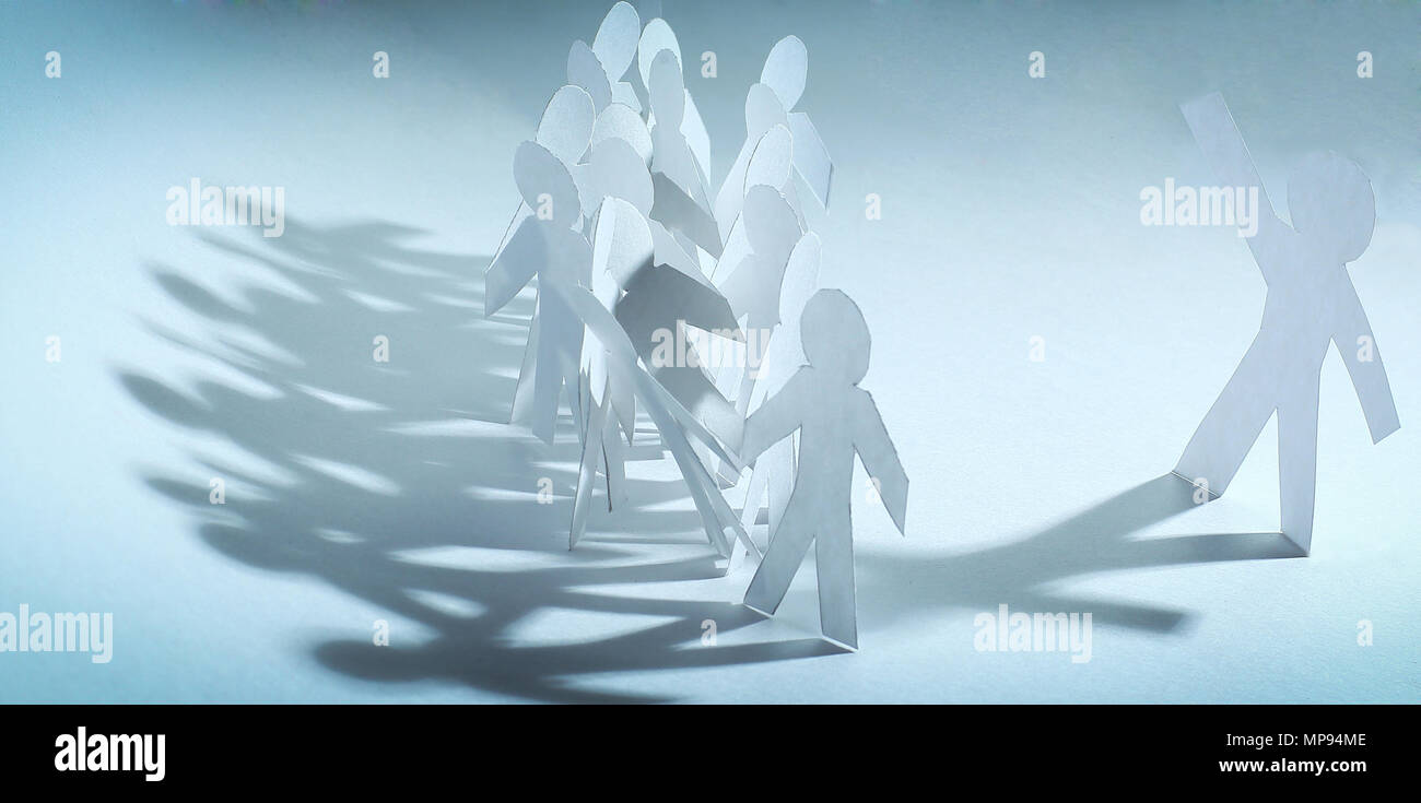 concept of leadership.group of paper men paper background Stock Photo ...