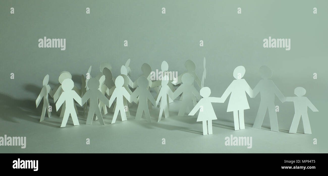 many paper men on the paper background Stock Photo - Alamy
