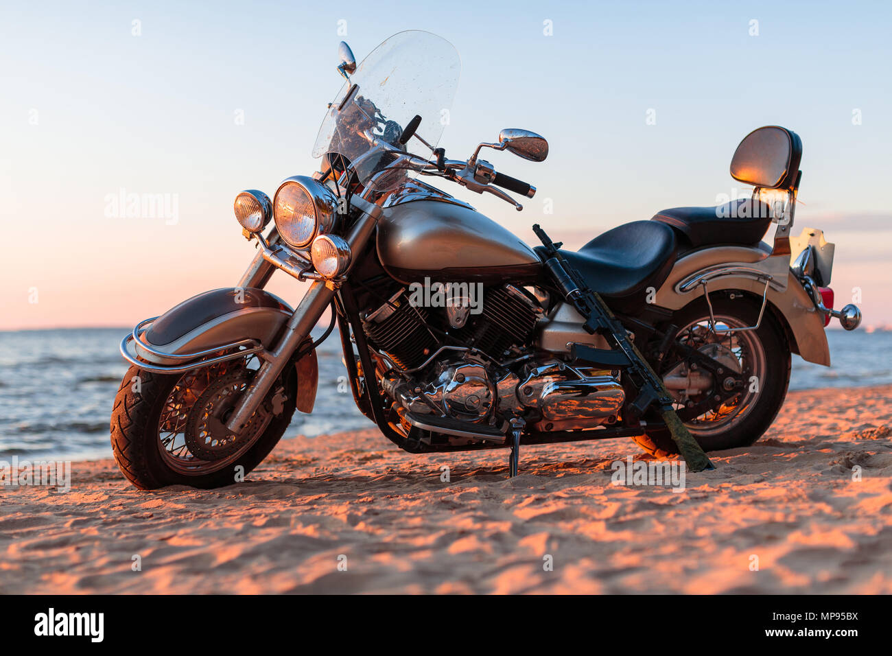 motorcycle on a sandy beach on the background of the sea Stock Photo ...