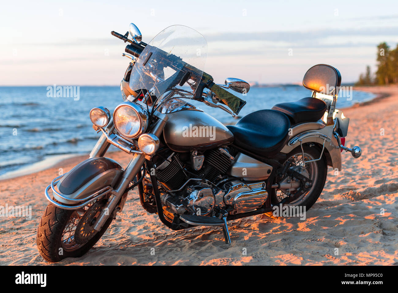 motorcycle on a sandy beach on the background of the sea Stock Photo ...